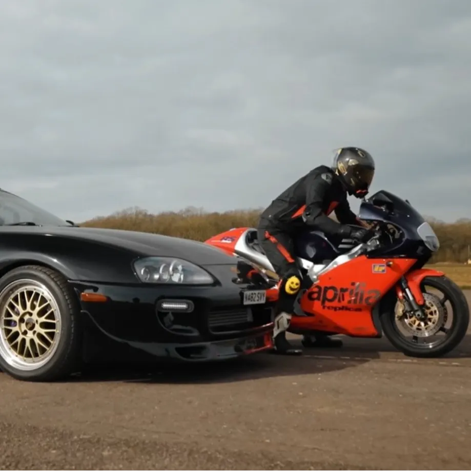 A 330-lb Aprilia RS250 Faces 3,300-lb Supra in a Drag Race